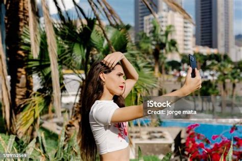 Confident Transgender Woman Taking Selfies With A Mobile Phone Stock