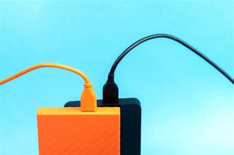 Premium Photo Two External Portable Hard Disk Drives Isolated On Light Blue Background