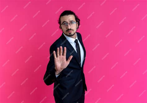 Free Photo Business Man In Black Suit And Glasses Making Stop Sign