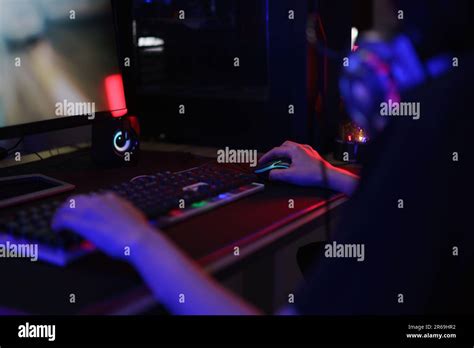 Female Cyber Hacker Gamer Using Keyboard And Mouse To Playing Games Or Hacking Programming