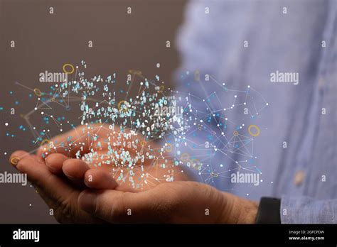 Businessman Holding A Floating Network Of Lines And Binary Code