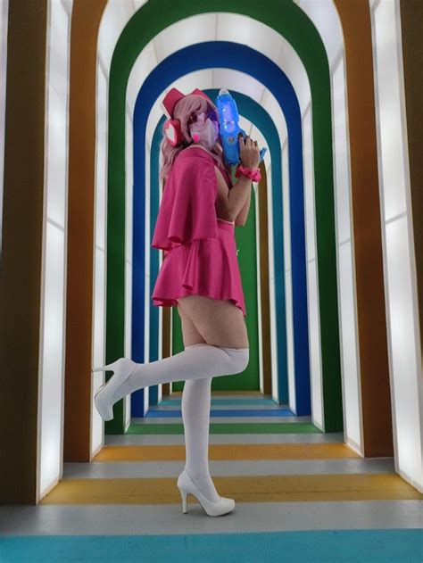 A Woman In A Pink Dress And White Stockings