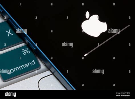 Closeup Up Of The Apple Logo And Progress Bar Seen On An Iphone When