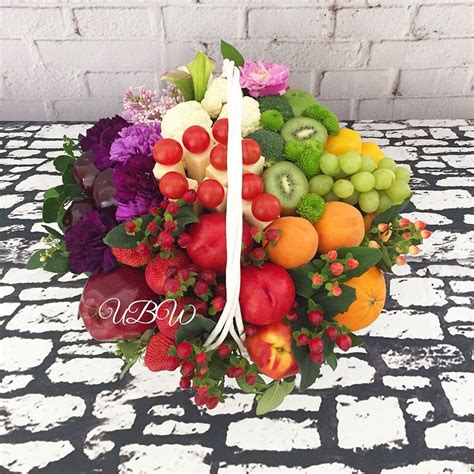 Beautiful And Unusual Edible Gift Basket Made Of Fresh Fruits Vegetables And Flowers