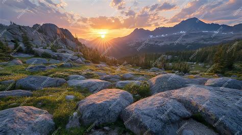 Sunset Over Rocky Mountain Landscape With Sun Rays Premium Ai