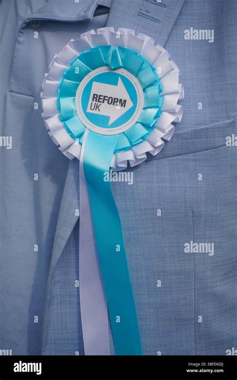 London Uk 1 June 2025 A Reform Uk Activist Wearing A Rosette