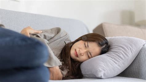 Woman Lying Chills With High Fever On Sofa Stock Image Image Of Fall