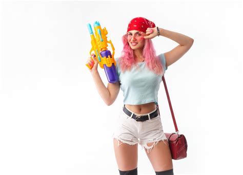 Premium Photo Sexy Girl With A Water Gun In Summer Clothes Isolated On A White Background Copy