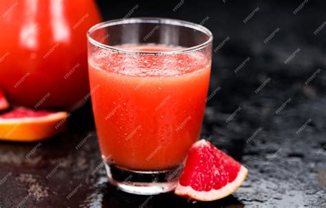 Premium Photo | Freshly squeezed Grapefruit Juice selective focus