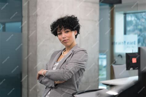 Premium Photo Portrait Of Successful Female Software Developer With A Curly Hairstyle At