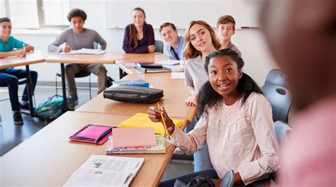 Download Teacher Discussing Class Students Listening Wallpaper