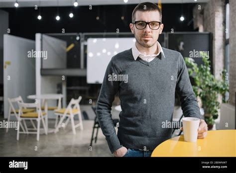 Employee Resting With Cup Of Coffee In Lecture Hall Bearded Worker