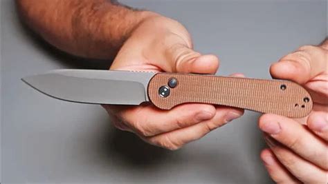 Who Invented The Button Lock On Knives