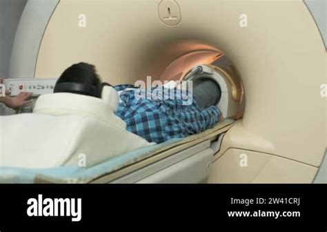 Woman Doctor Makes Knee Joint Mri Scanning Young Man Patient On