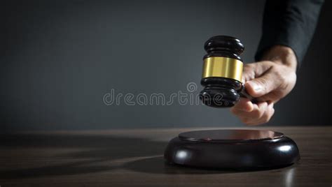 Male Judge In A Courtroom Striking The Gavel Stock Image Image Of