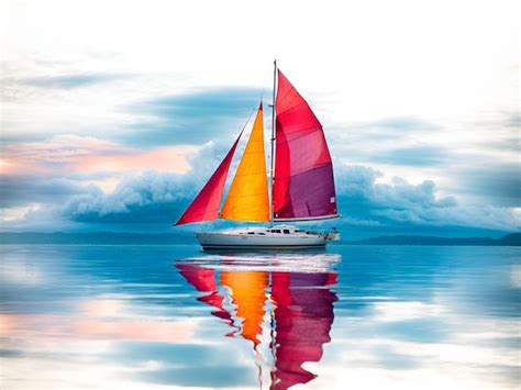 premium ai image sailboat with colorful sails on tranquil water