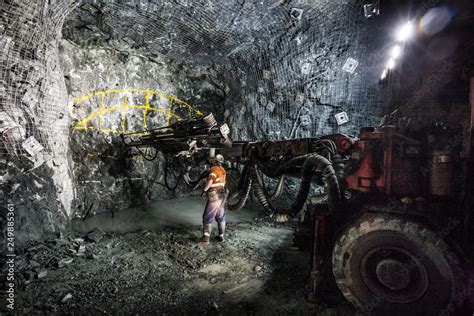 Drilling to place explosives at an underground tunnel at a copper mine in NSW Australia Stock ...