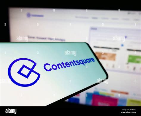 Cellphone With Logo Of Analytics Platform Company Contentsquare On Screen In Front Of Business