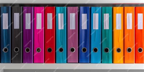 Colorful File Binders Neatly Arranged On Office Shelves Concept Office