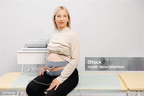 Woman Pregnant Checking Fetal Heart Beat By Fetal Monitoring Expectant Mother With Midwife