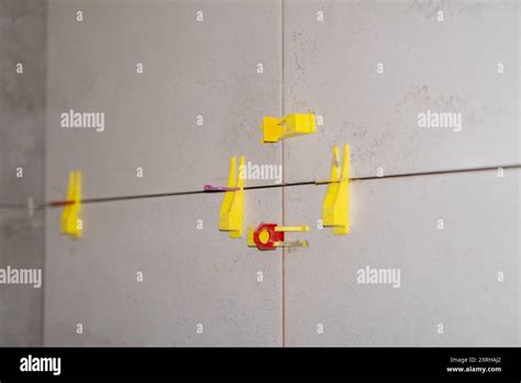 Tile Installation Using Plastic Leveling Clips And Wedges Ensuring A