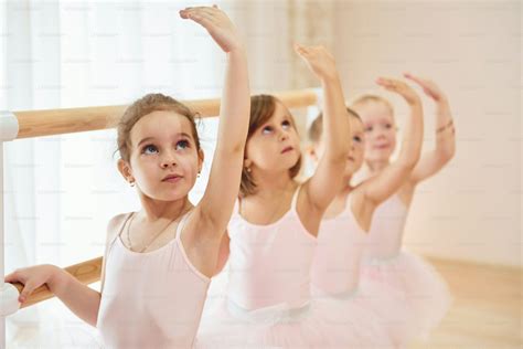 Little Ballerinas Preparing For Performance By Practicing Dance Moves