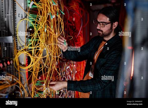 Side View Portrait Of Bearded Man As System Administrator Setting Up