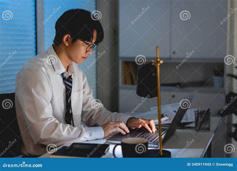 overwork concept the man sitting at his desk and focusing on working