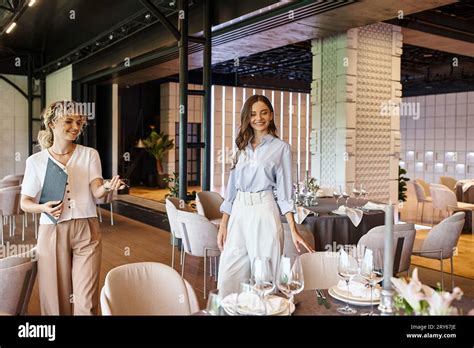 event manager with clipboard showing table with banquet setting to