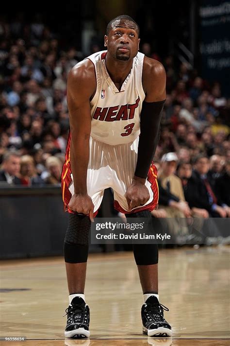 Dwyane Wade Of The Miami Heat Takes A Break From The Action During
