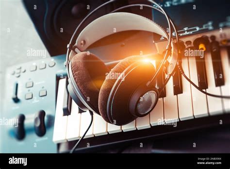 Keyboard Or Synthesizer With Headphones And Sound Card Computer