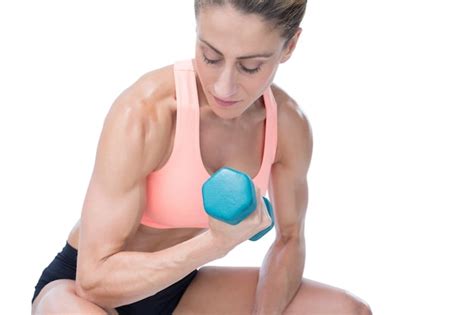 Premium Photo Strong Woman Doing Bicep Curl With Blue Dumbbell