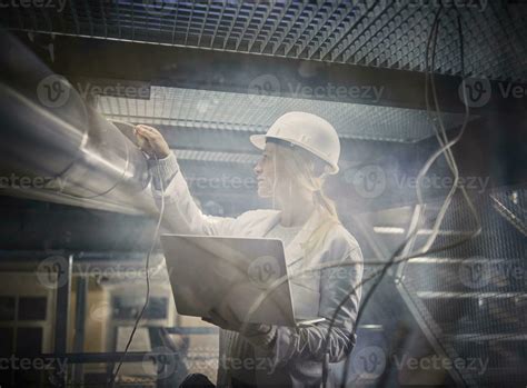 Female Technician Working On Pipeworks Using Laptop 29821261 Stock Photo At Vecteezy
