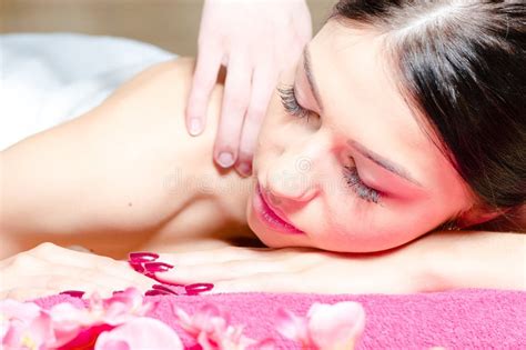Beautiful Woman Relaxing During Massage With Flowers Perfect Skin