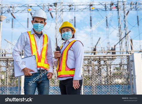 Asian Male Female Electrician Standing Substation Stock Photo 1986431813 Shutterstock