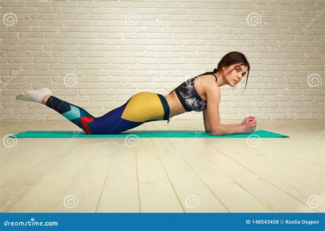 Young Slim Athletic Woman Doing Fitness Stretching Exercises And