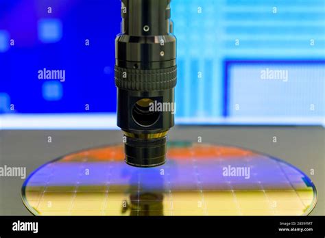 Silicon Wafer With Semiconductor Microchip On Machine Process Examining Testing In Microscope