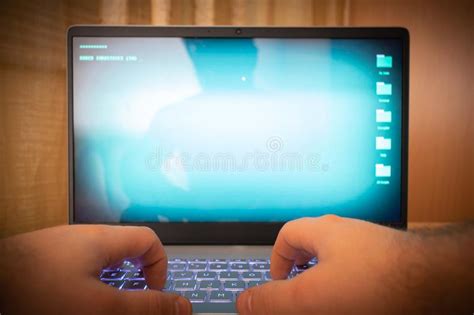 Hacker Using Laptop Lots Of Digits On The Computer Screen Stock Image