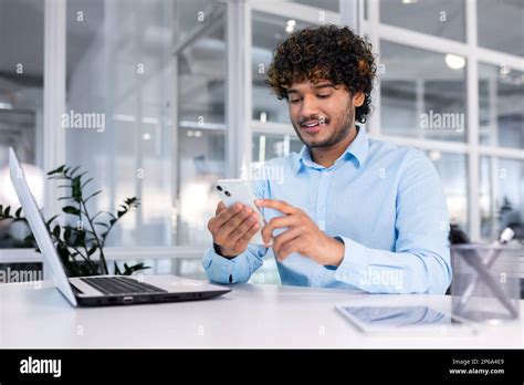 Young Indian Programmer Inside Modern Office Sitting At Workplace Man