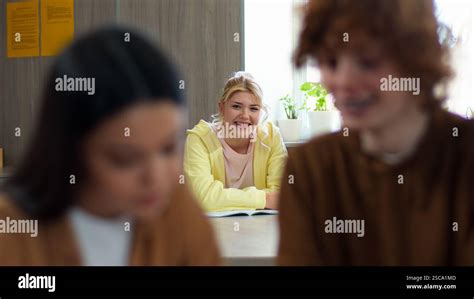 Three School Mates Students Pupils Studying In Class Lesson Blurry Man
