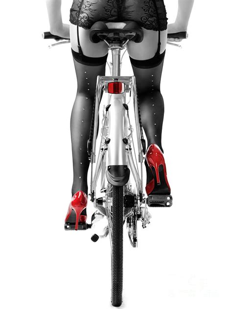 Sexy Woman In Red High Heel Shoes And Stockings Riding Bicycle Photograph By Maxim Images
