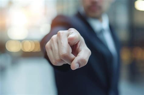 Premium Photo A Man In A Suit Pointing At The Camera