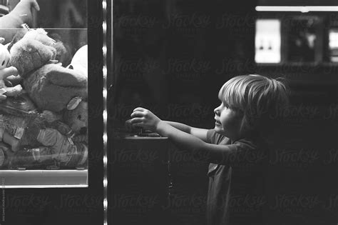 Young Girl Playing Arcade Game By Stocksy Contributor Jess Lewis Stocksy