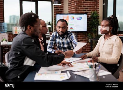 Startup Employees Doing Teamwork To Plan Project Analyzing Information