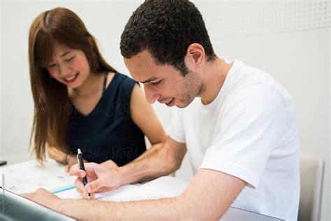 Mxied Race Babe Couple Studying In A Classroom By Stocksy Contributor Studio Marmellata