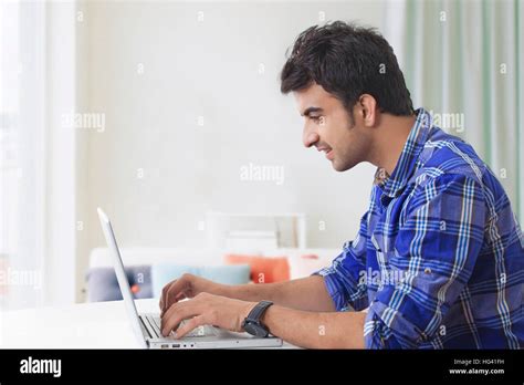 Smiling Man Using Laptop Computer Stock Photo Alamy