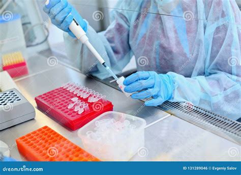 Dna Test In The Lab A Laboratory Technician With A Dispenser In His