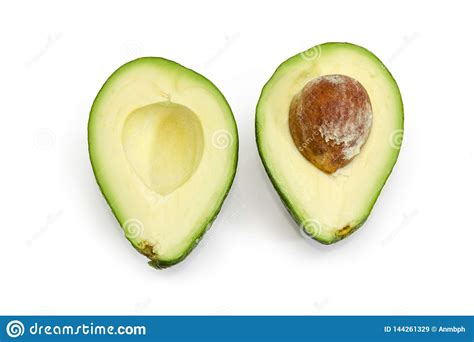 Green Avocado Fruit Cut In Half On A White Background Stock Image