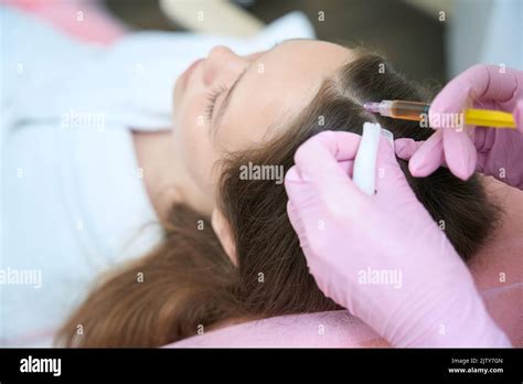 Beautician Makes Injection In Head Girls For Better Hair Growth Stock