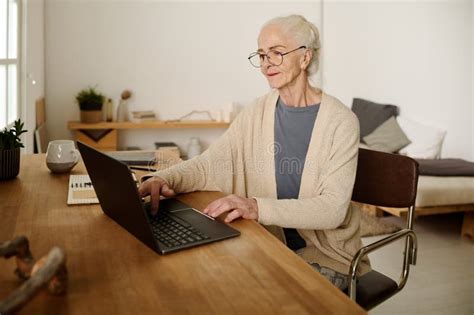 looking at laptop screen and pushing key stock image image of